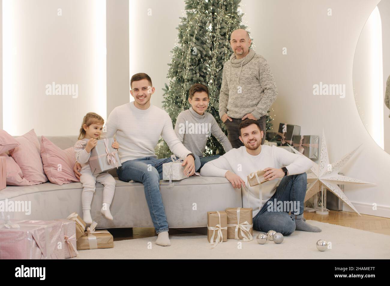 Young father with three sons aand one granddaughter. Big family at ...