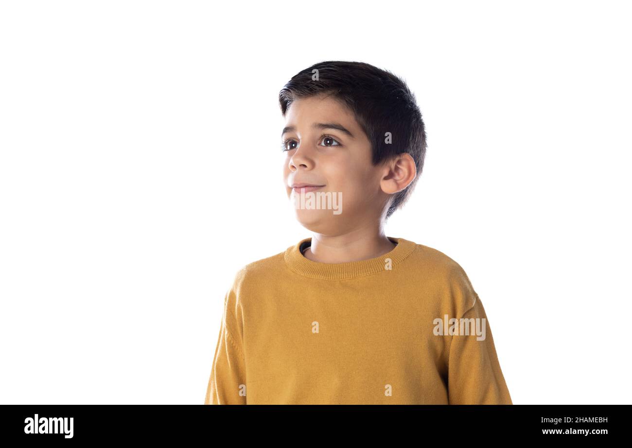 Pensive cute Spanish child with yellow t-shirt isolated on a white ...