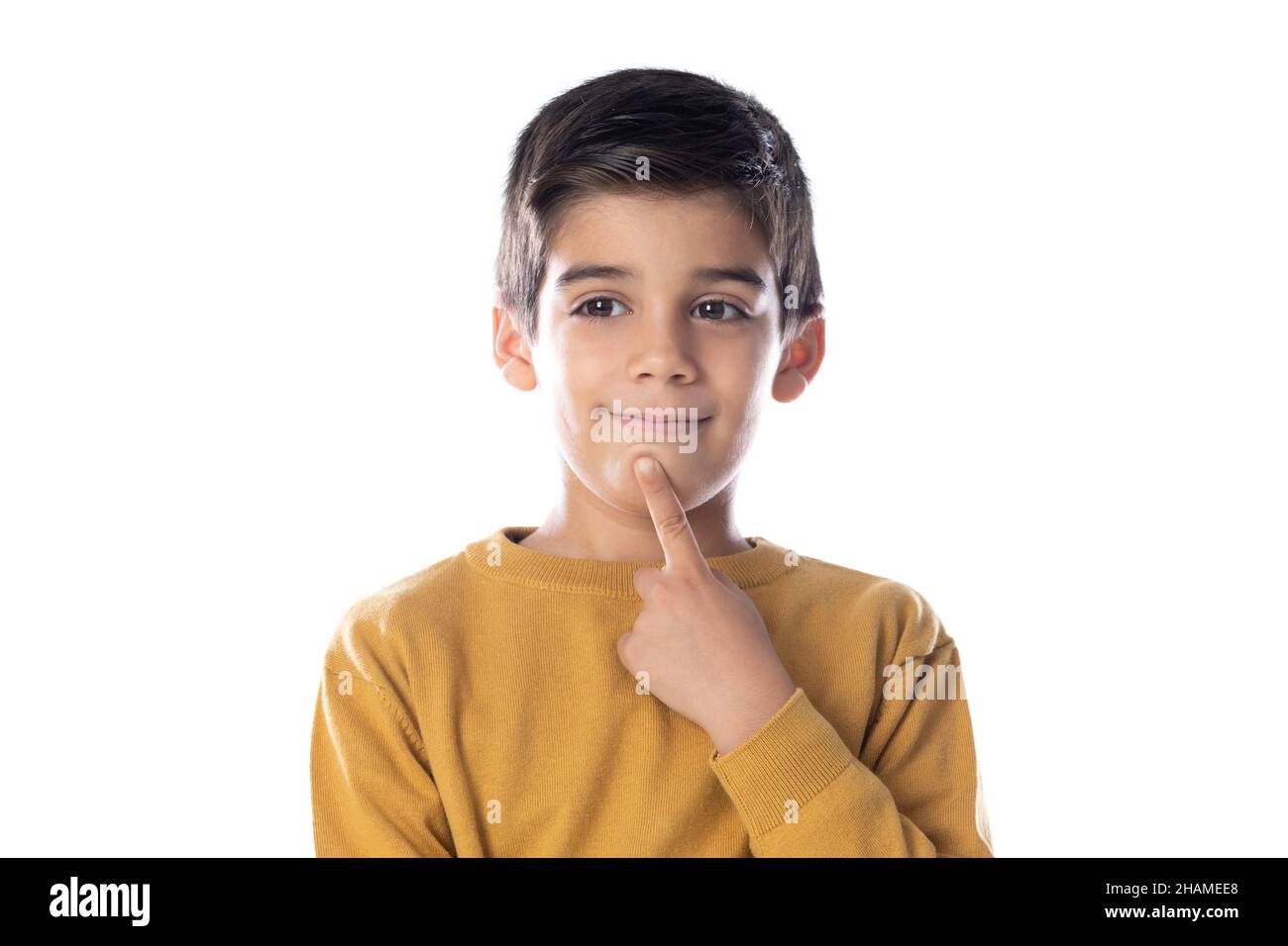 Pensive cute Spanish child with yellow t-shirt isolated on a white ...