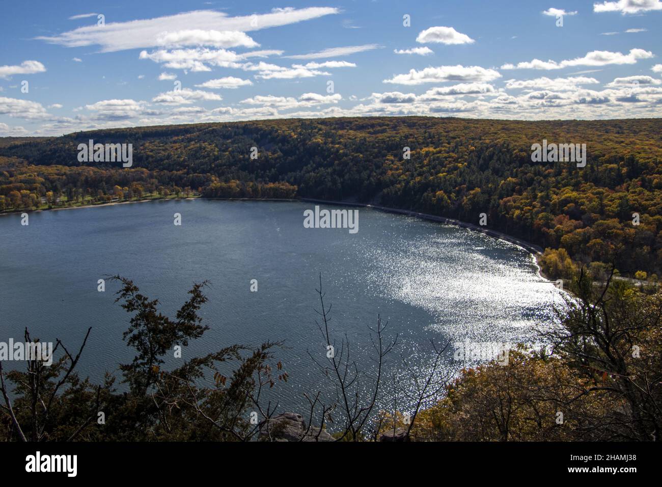 Beautiful view of Devil's Lake surrounded by dense trees and hills in ...
