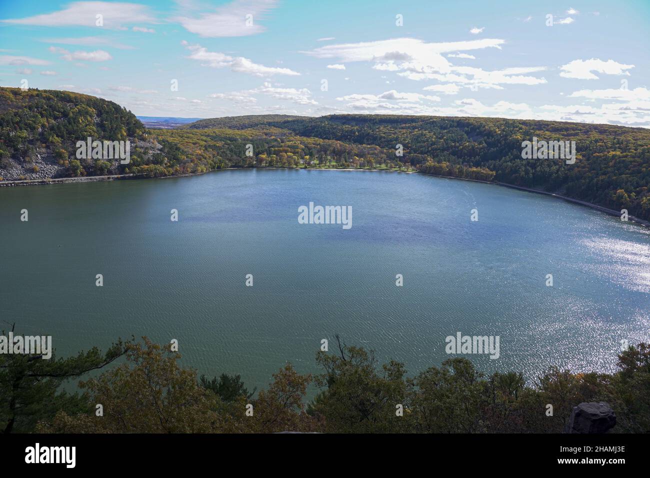 Beautiful view of Devil's Lake surrounded by dense trees and hills in ...