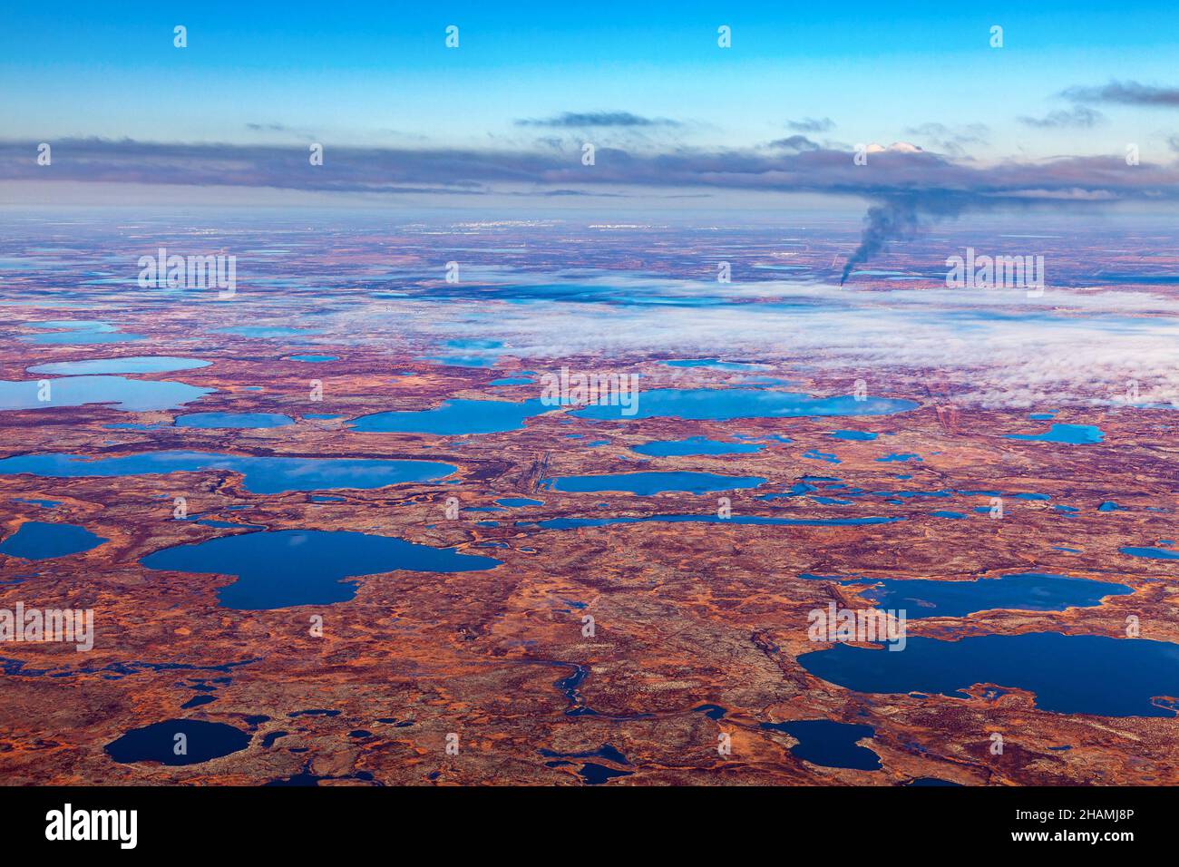 Aerial view of the tundra in autumn. Oilfield in marsh terrain under ...