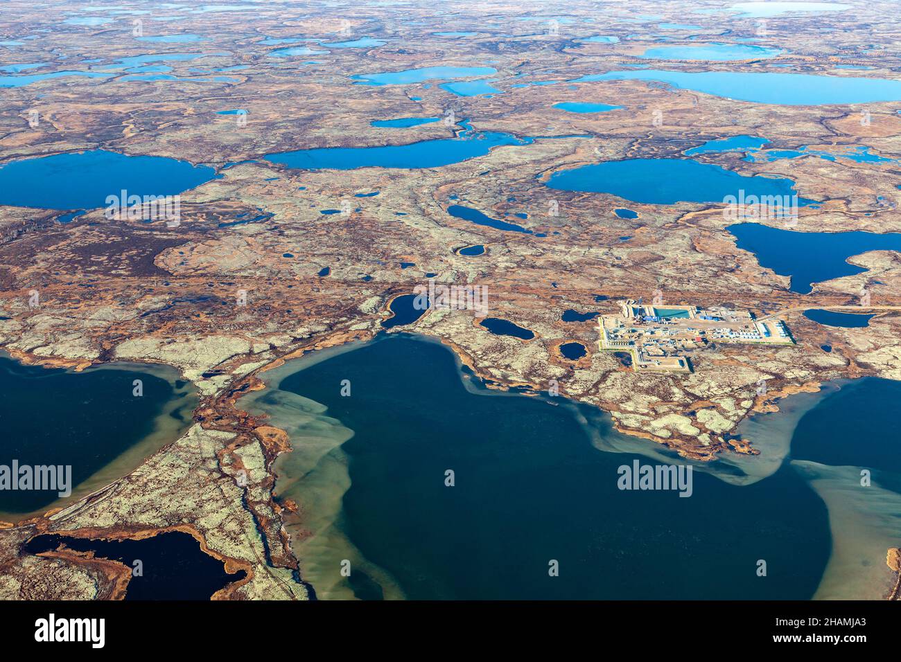 Aerial view of the tundra in autumn. Oilfield in marsh terrain under ...