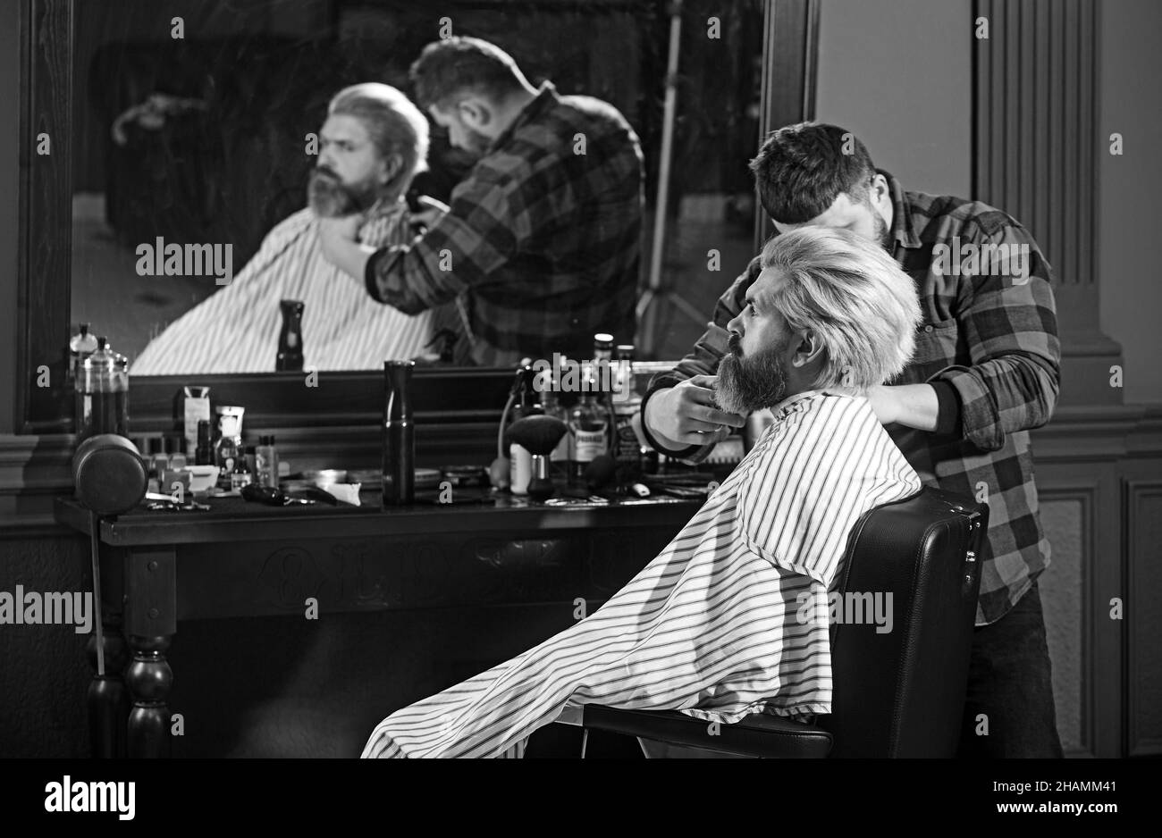 Barber trimming clients hair hi-res stock photography and images - Alamy