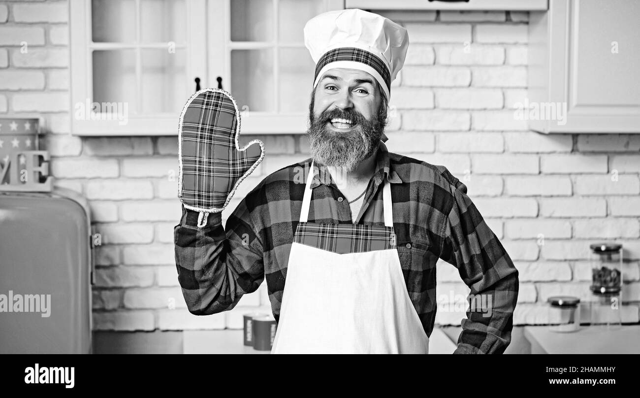 Bearded chef cooking tasty dishes on a kitchen in a restaurant Stock ...