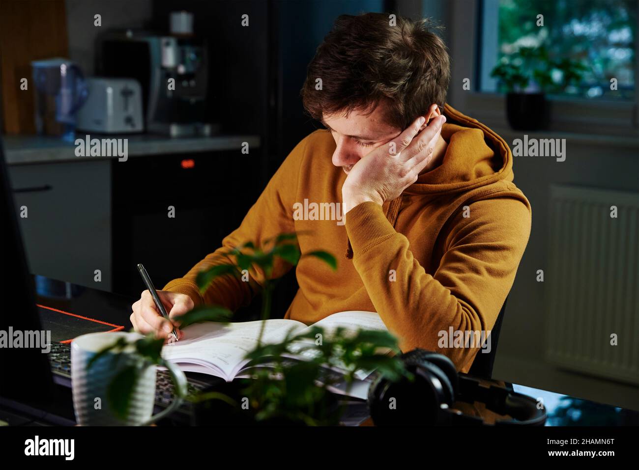 Man works late at home workplace, remote work concept. Burnout and ...