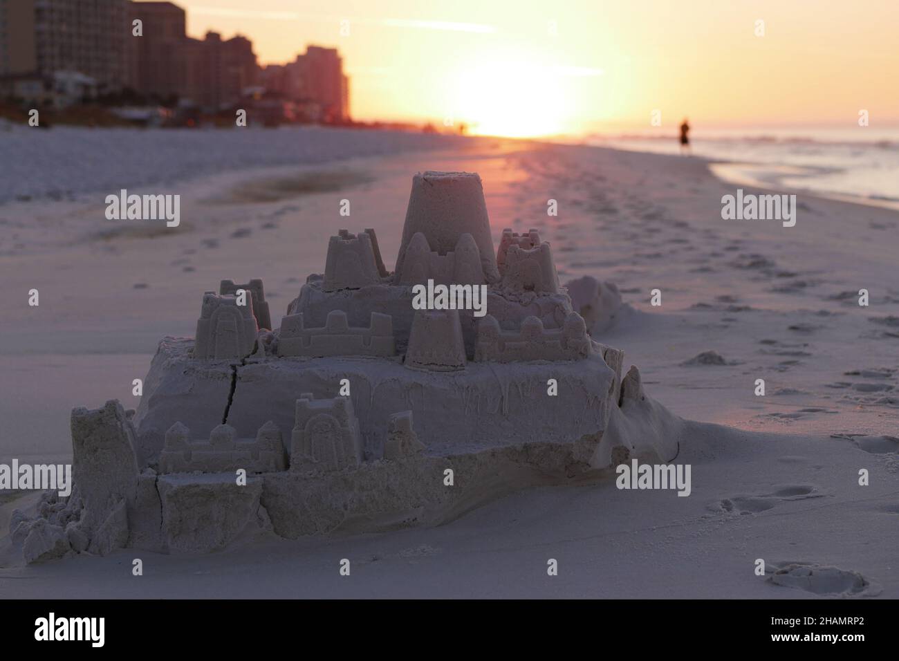 Scenic view of the sandcastle on the beach at amazing sunset in Florida ...