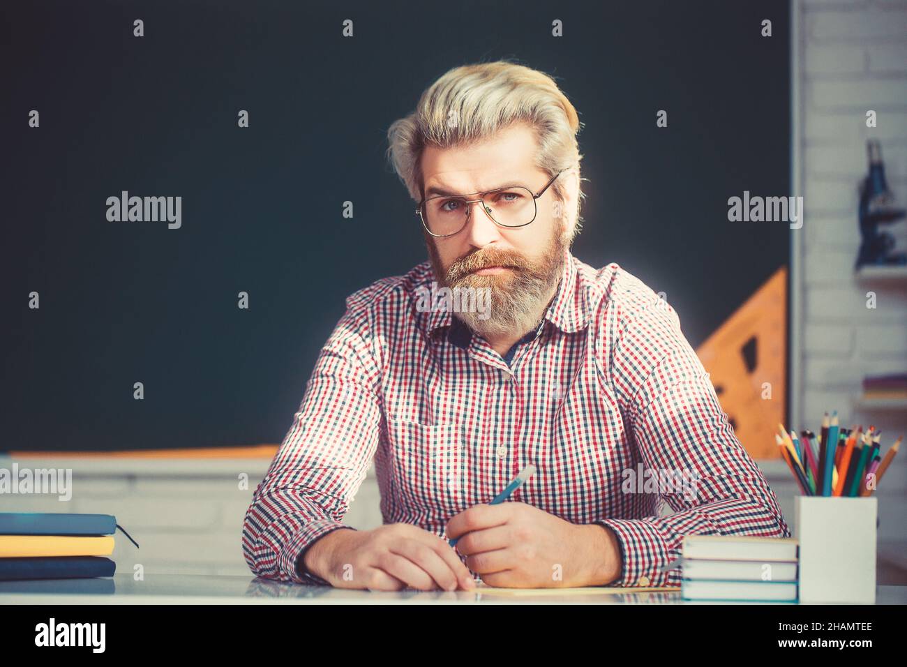 E-Learning concept with student holding his modern laptop computer ...