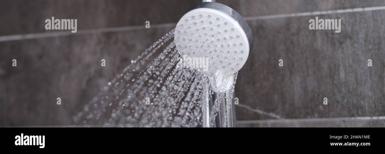 Cheap tap is pouring rain in the bathroom closeup Stock Photo - Alamy