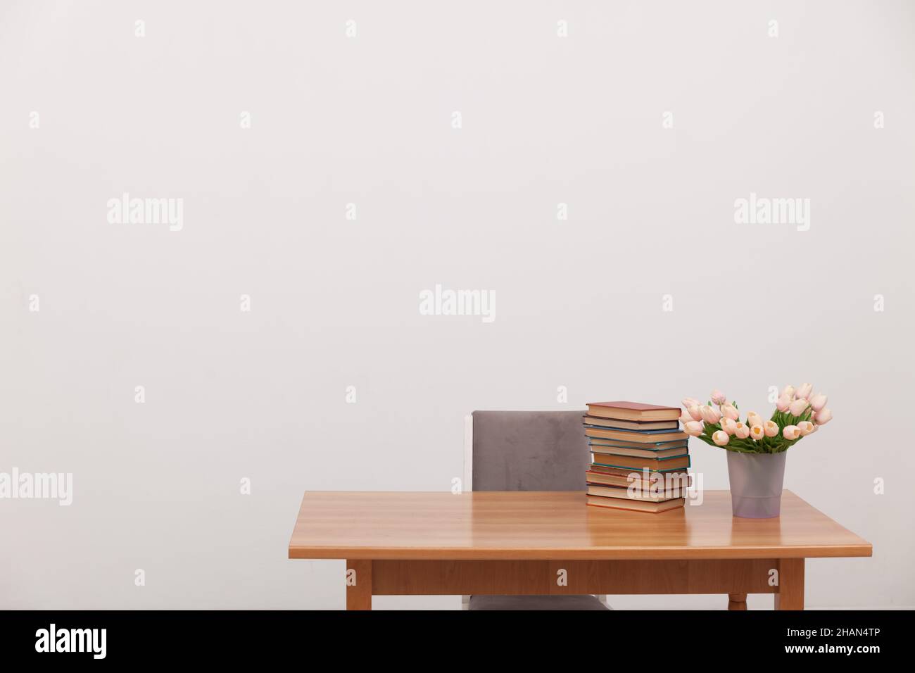 desk with flowers and books for learning Stock Photo - Alamy