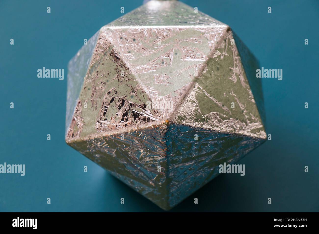 geometric figure icosahedron on the blue background, painted ...