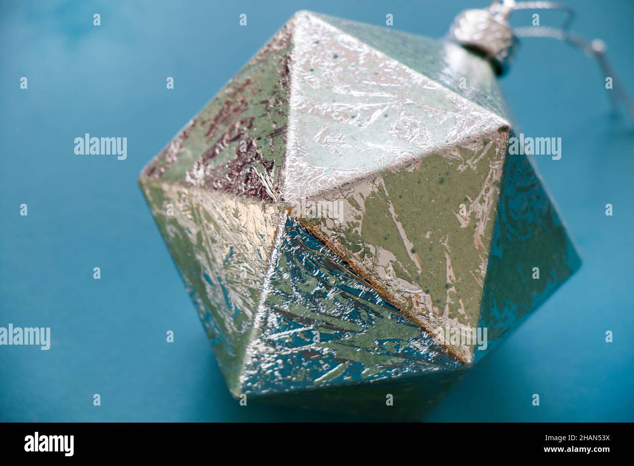 geometric figure icosahedron on the blue background, painted ...