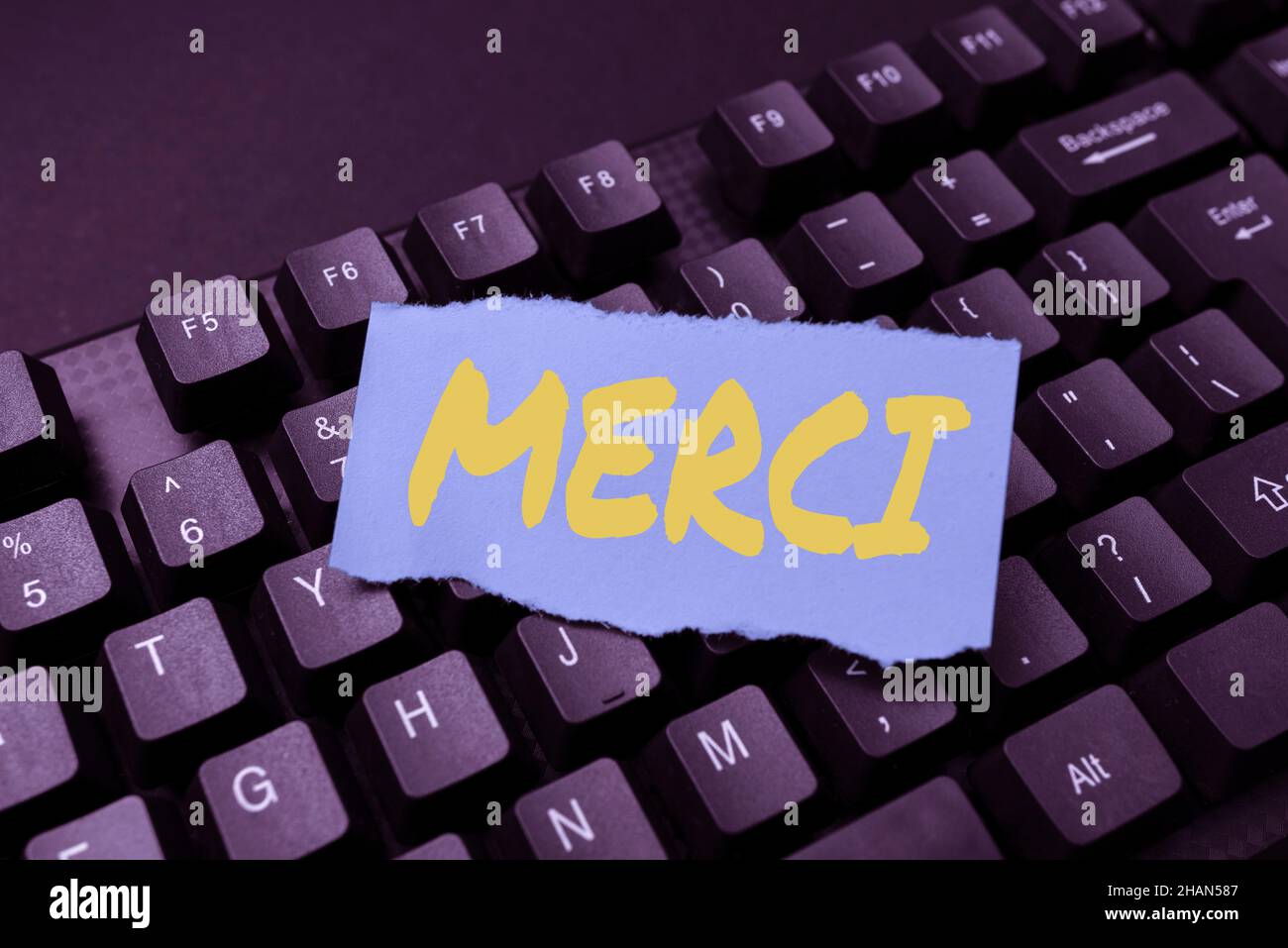 Hand writing sign Merci. Concept meaning what is said or response when ...