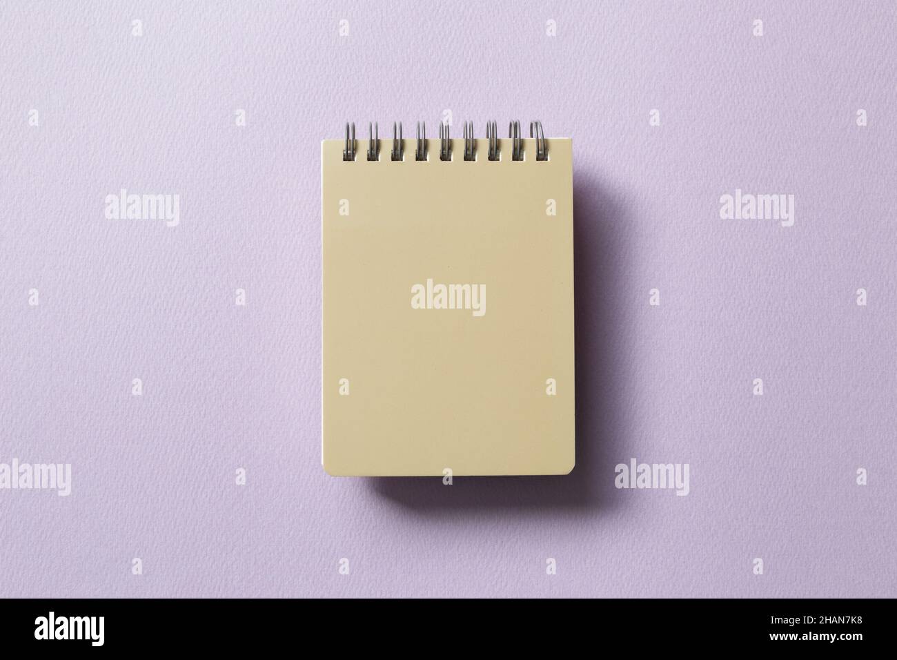 Beige notepad isolated on purple background. top view, copy space Stock ...
