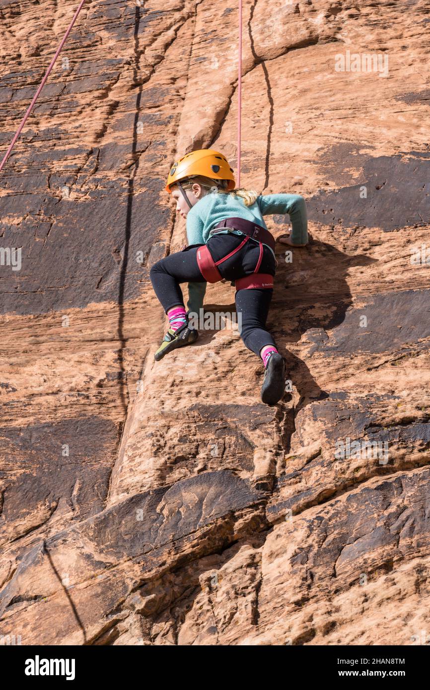 A seven-year old girl learning to rock climb at the Wall Street ...