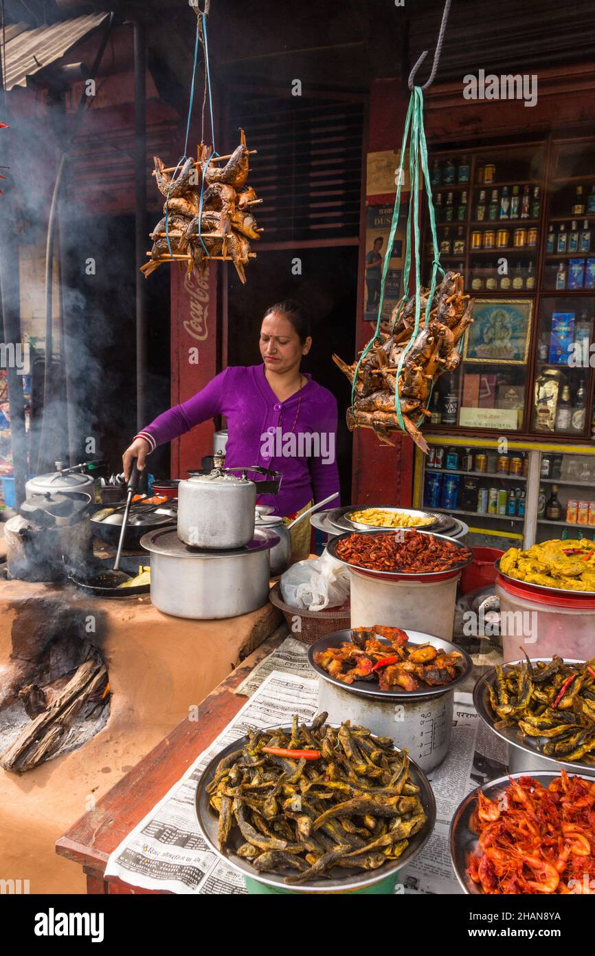 Woman cooking smoky wood stove hi-res stock photography and images - Alamy