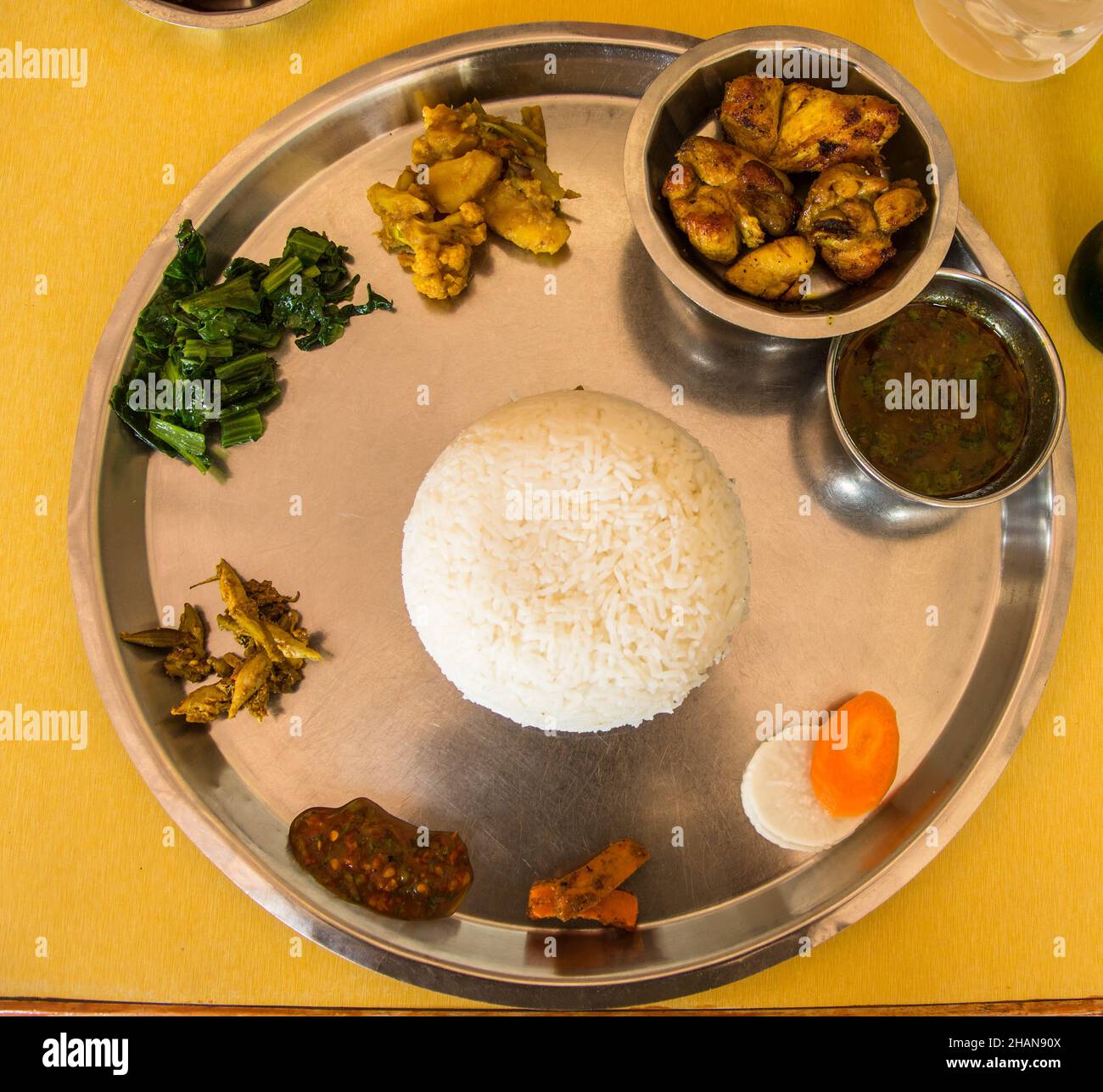 Lunch in a typical Nepali restaurant with rice, chicken and vegetables ...