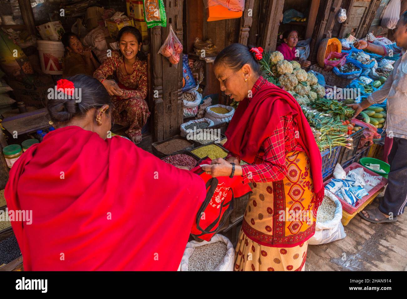 Newari women shopping for food in a streetside market in the medieval ...