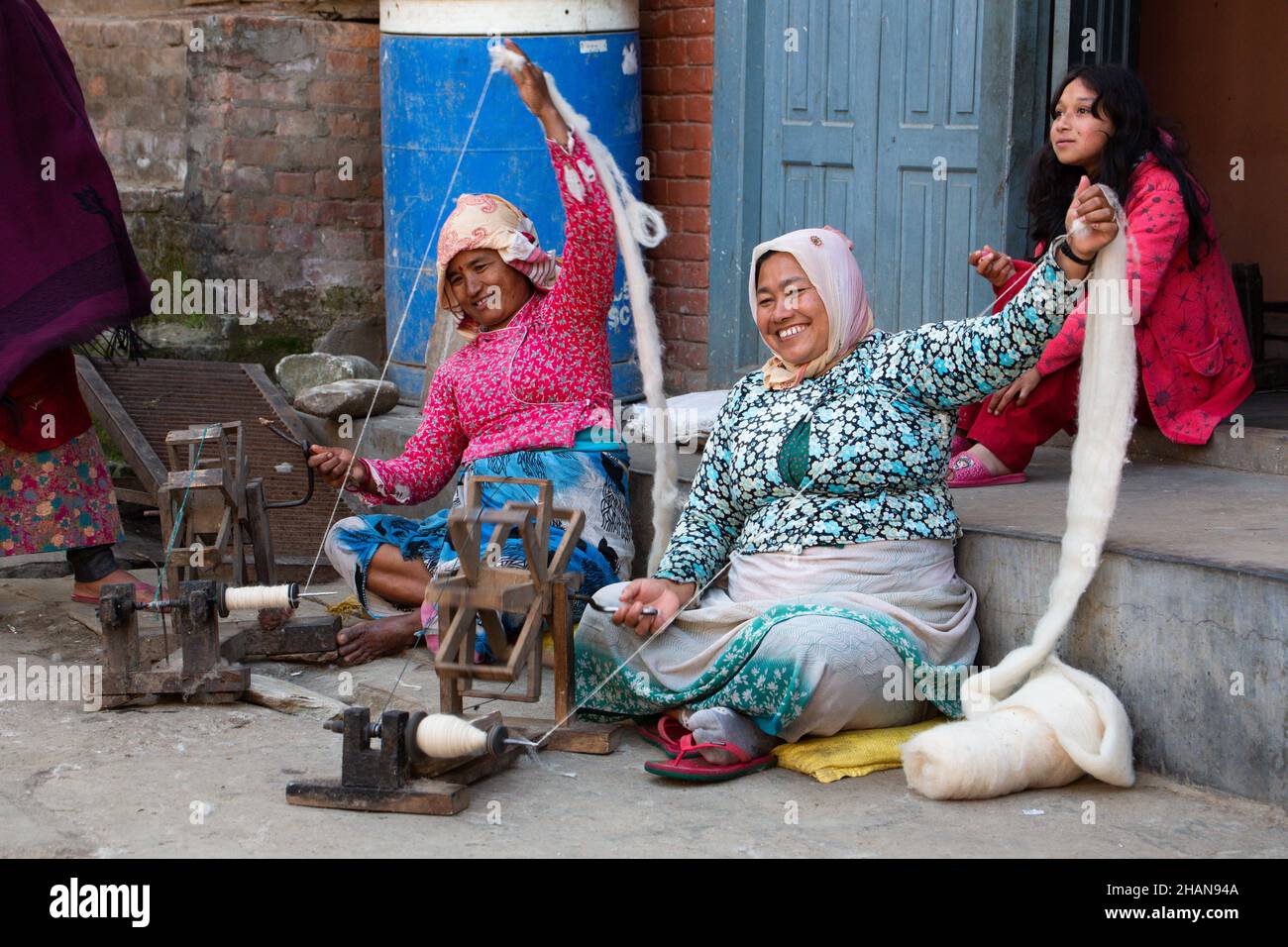 Nepali women spinning wool thread by hand in the medieval Newari ...