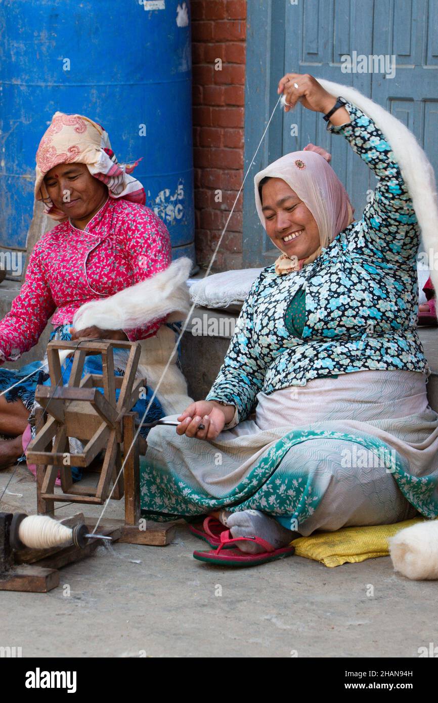 Nepali women spinning wool thread by hand in the medieval Newari ...