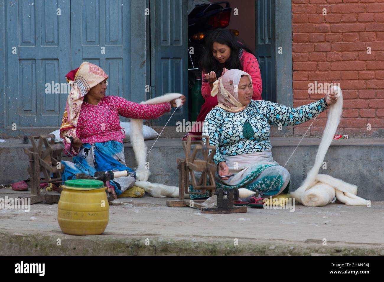 Nepali women spinning wool thread by hand in the medieval Newari ...