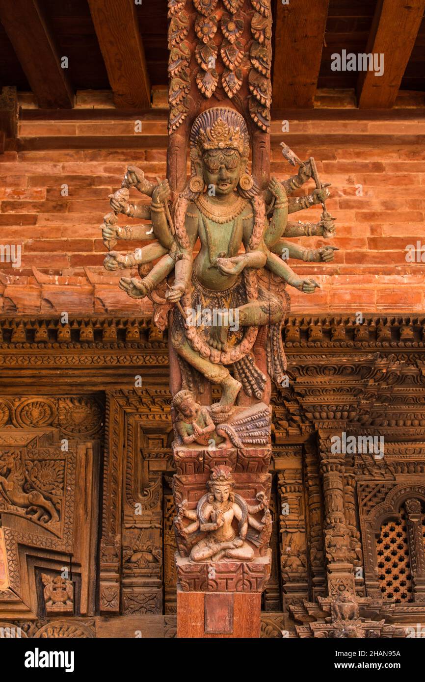 Wooden carving of a deity on the roof trusses in the Mul Chowk of the ...