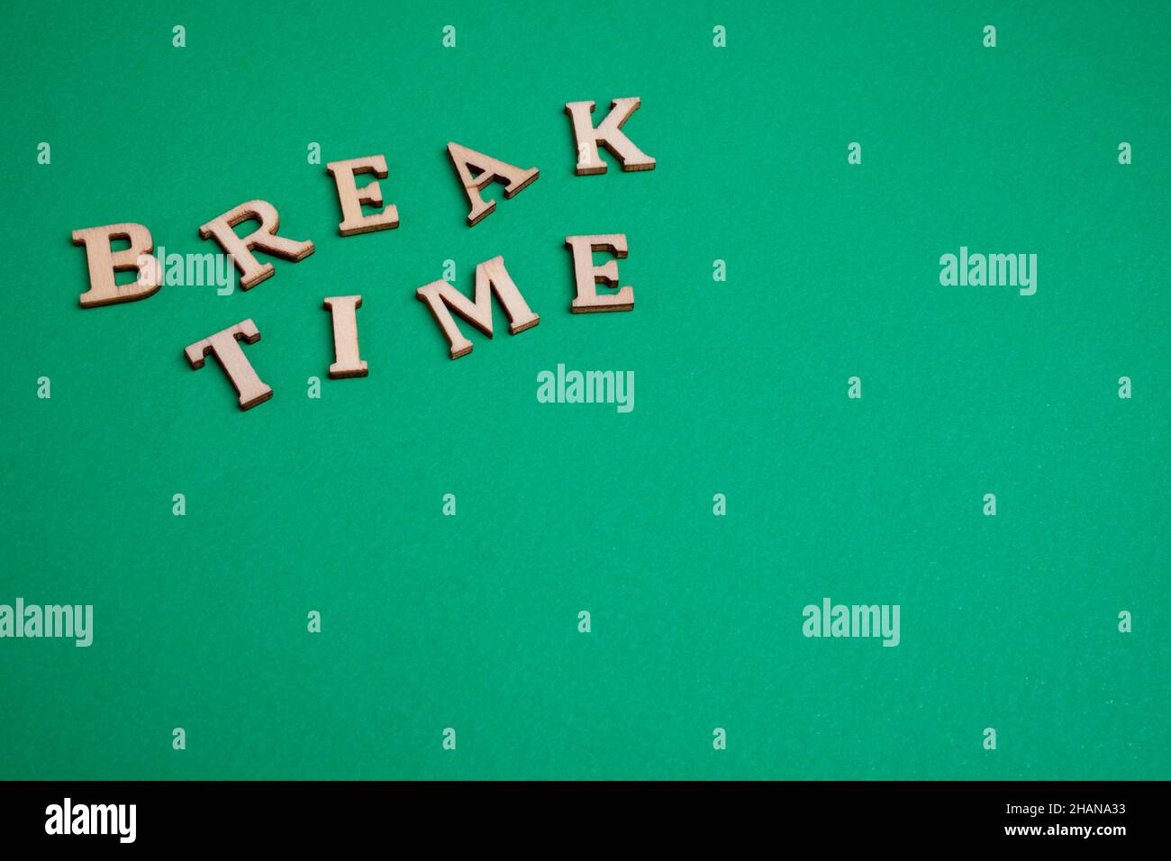 Break time word written with wood letters. break time text on green ...