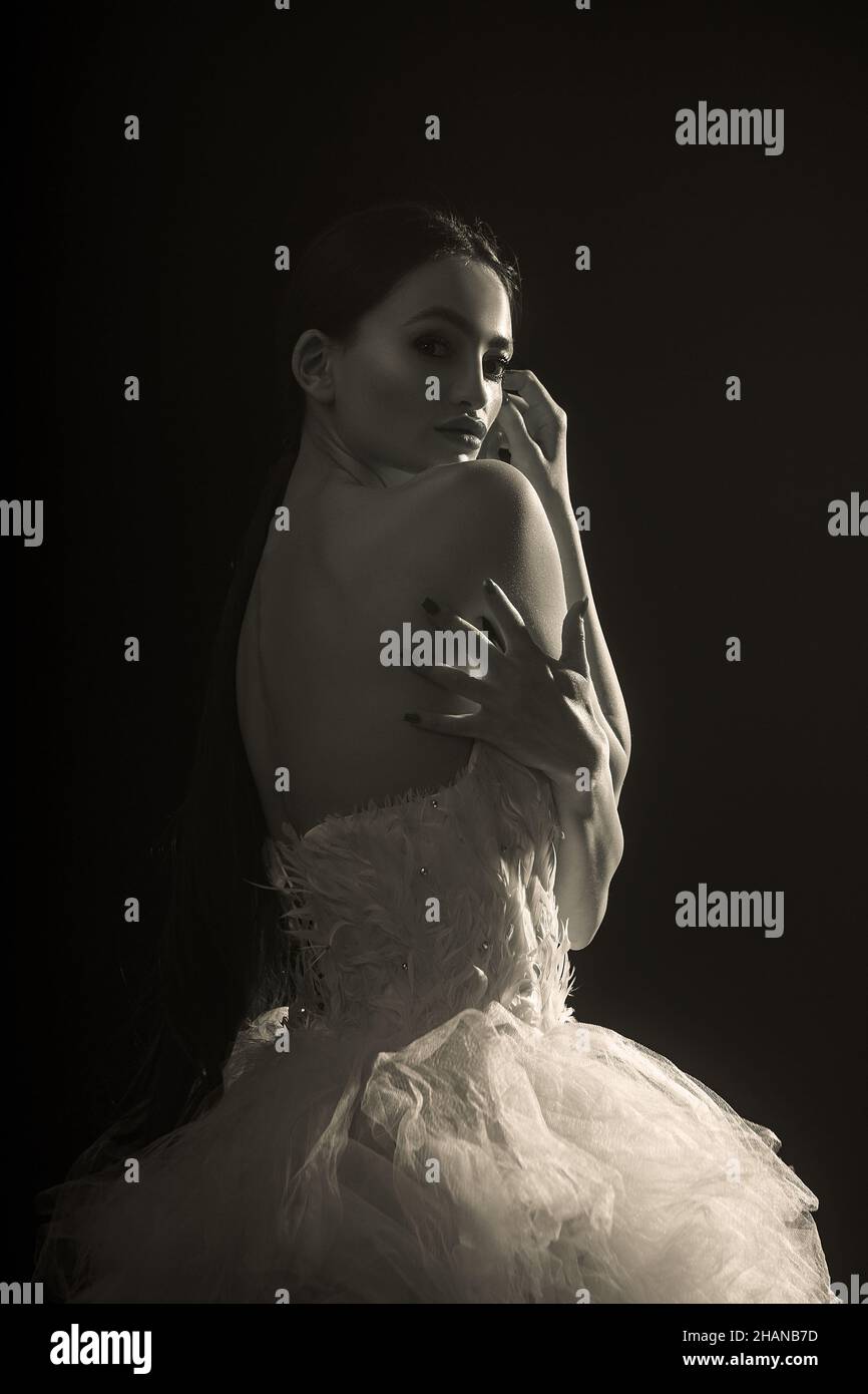 Beautiful young woman with amazing body-art as statue on dark ...