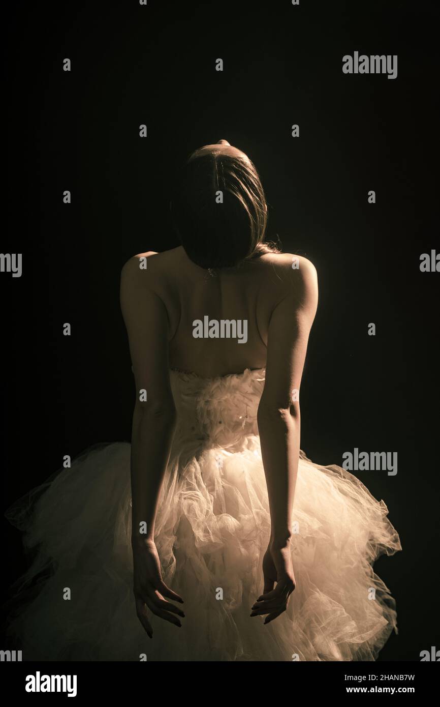 Young beautiful ballet dancer is posing in studio, view back Stock ...