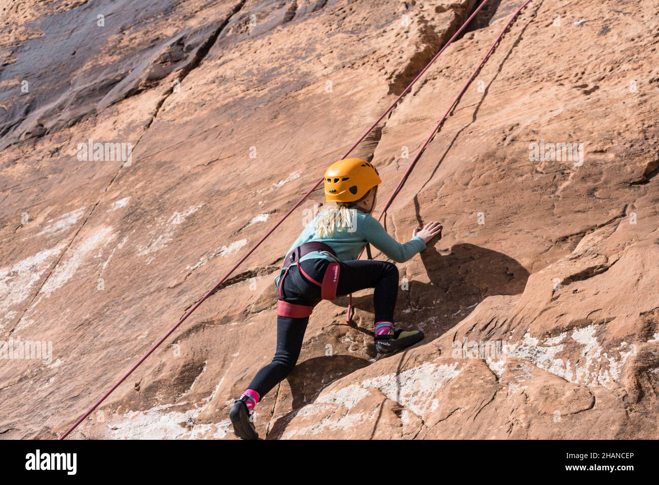 A seven-year old girl learning to rock climb at the Wall Street ...
