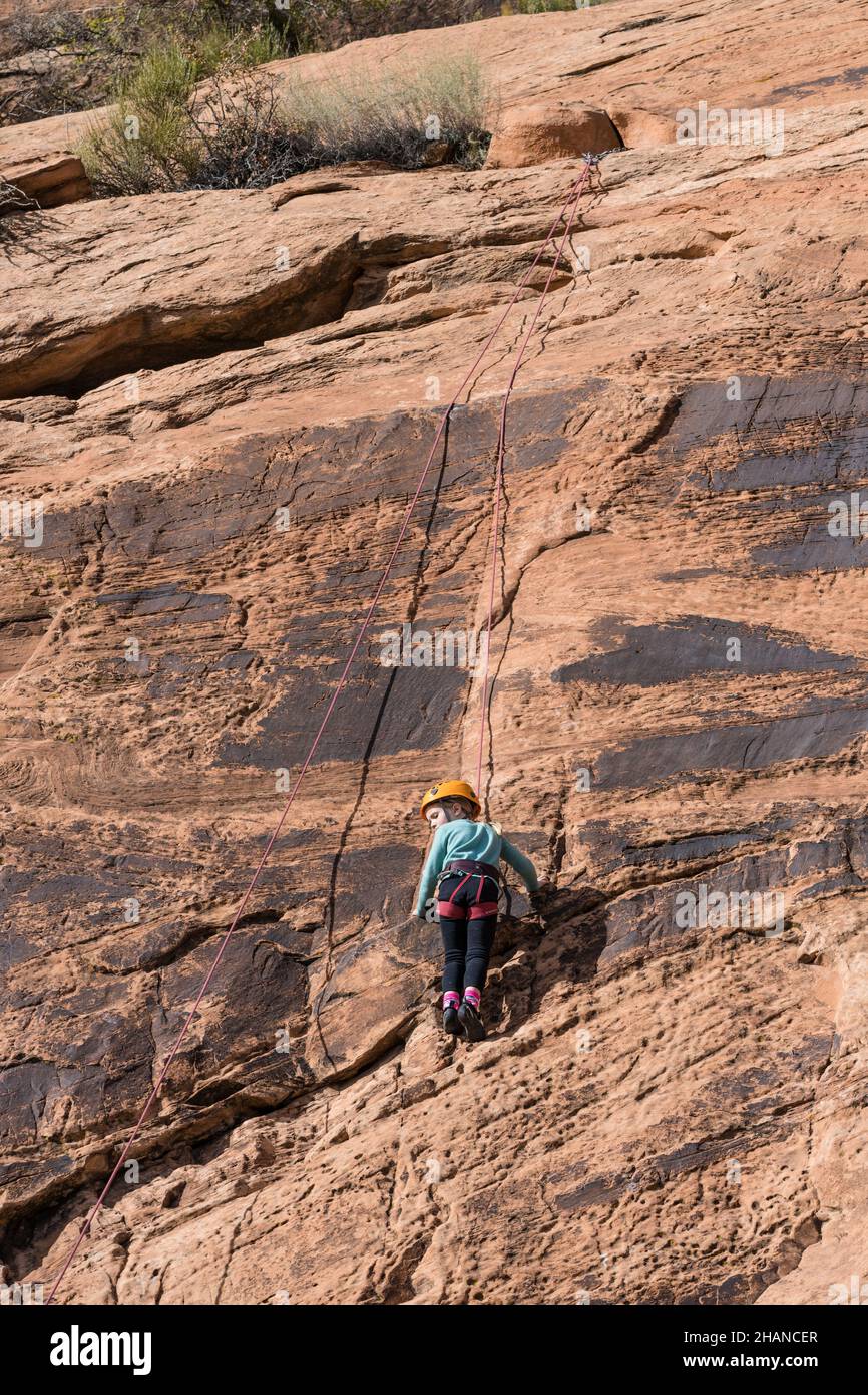 A seven-year old girl learning to rock climb at the Wall Street ...