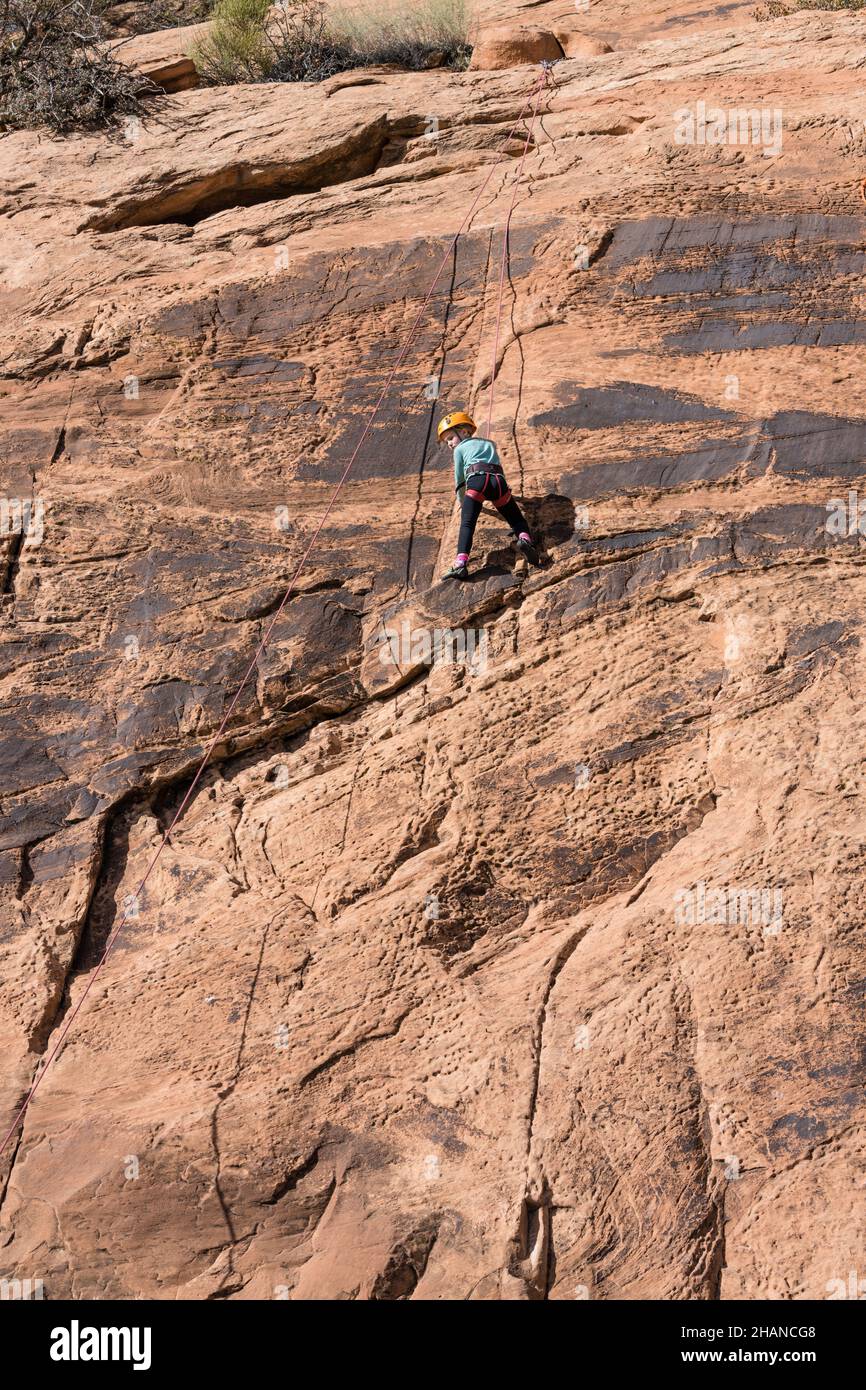 A seven-year old girl learning to rock climb at the Wall Street ...