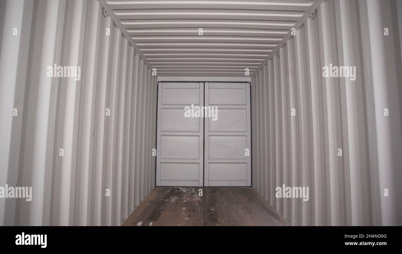 Inside large shipping container. Stock footage. View from inside locked ...