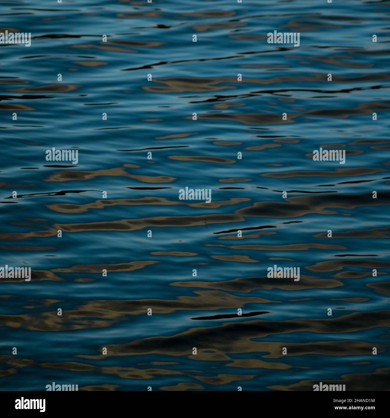 Vertical shot of waves with a reflection Stock Photo - Alamy