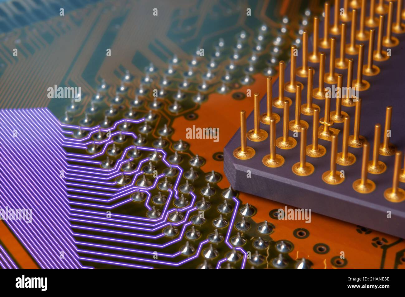 macro photo of printed circuit board with illuminated wires, pin grid ...