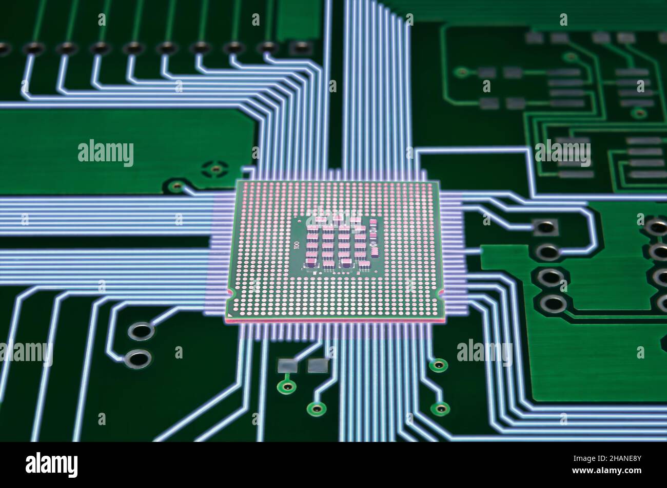 macro photo of printed circuit board with illuminated wires and central ...