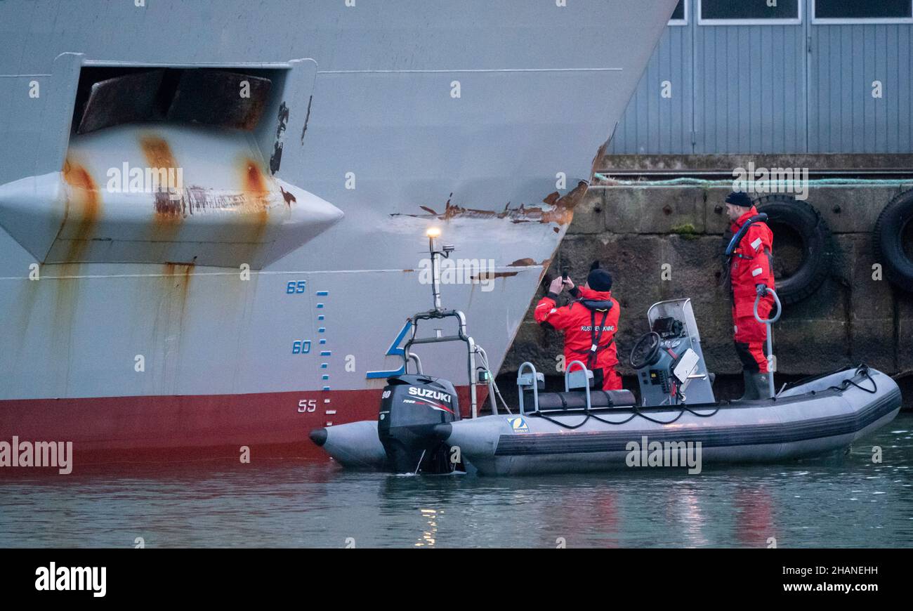 Personnel from the Swedish Coast Guard investigate the damaged ship ...