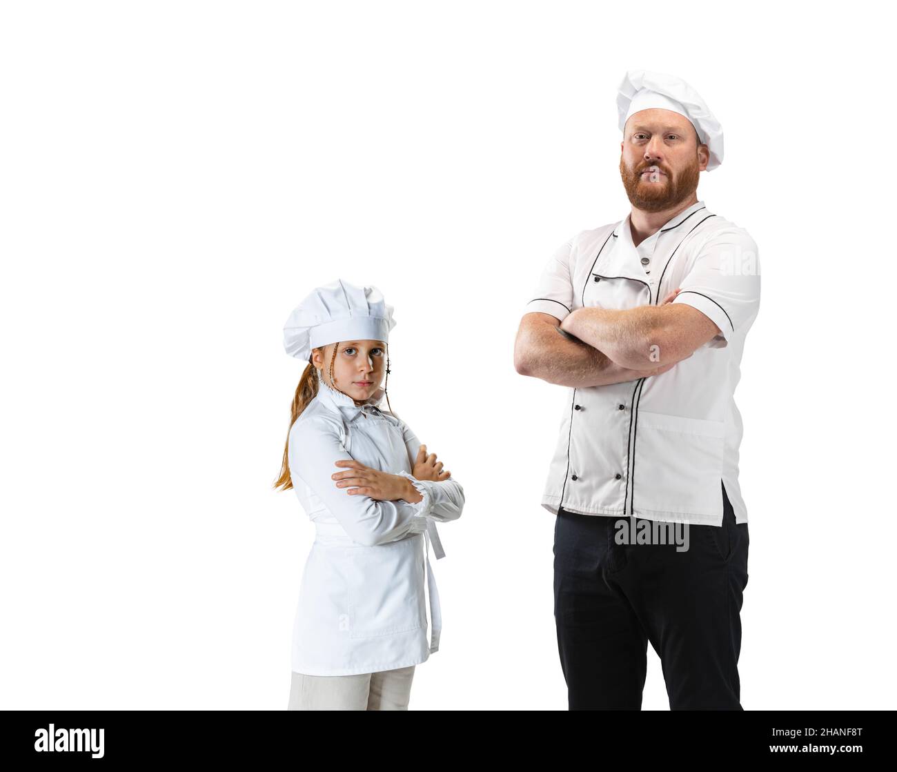 Young bearded man, cook, male chef in white uniform and his little ...