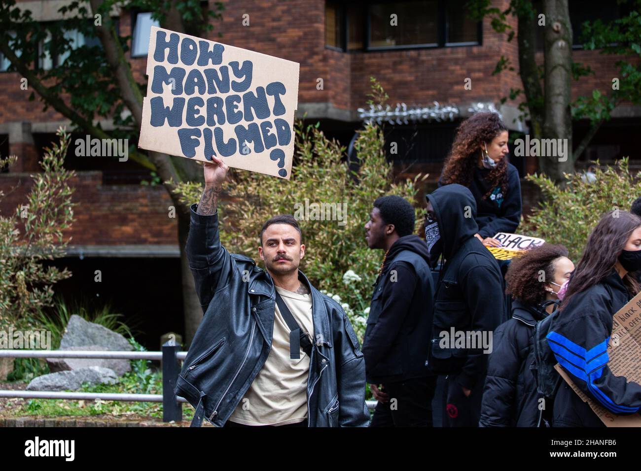 Protest activist holding placards hi-res stock photography and images ...