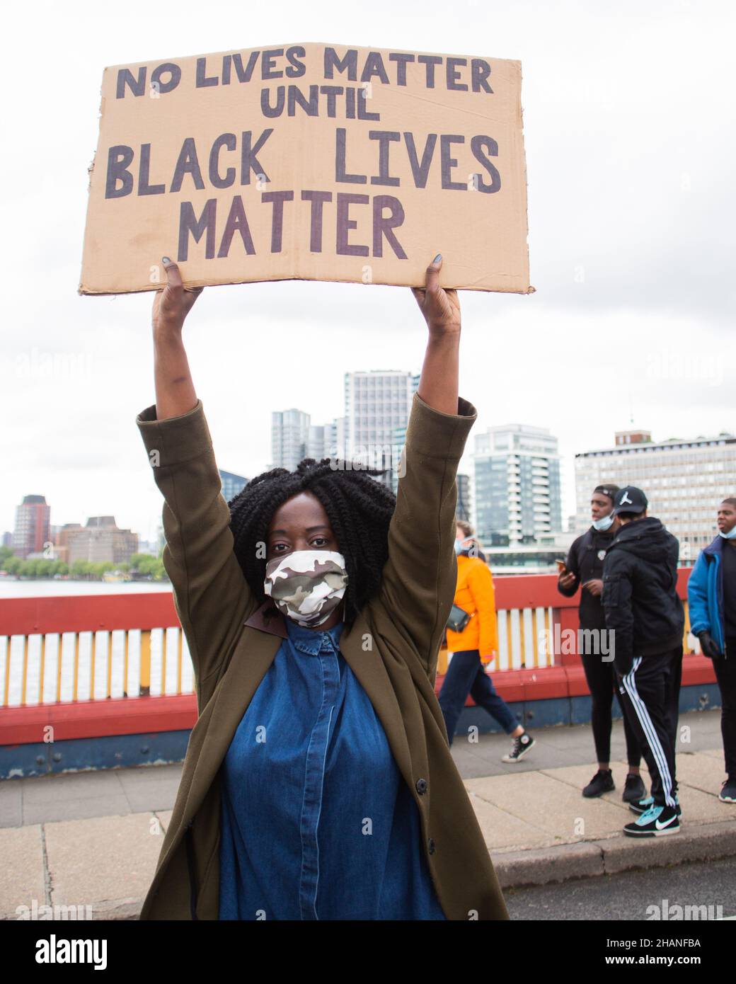Black Lives Matter protestor holding No lives matter until Black Lives ...