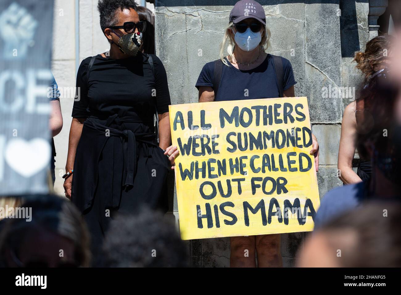 Black Lives Matter Protestors with sign all mothers were summoned when ...