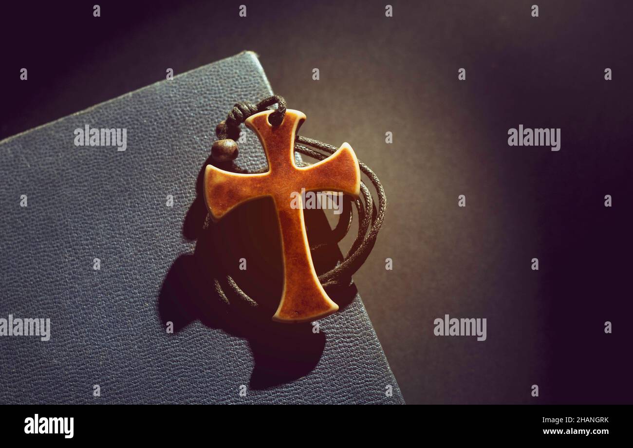 Holy Bible Christian Religion book and Cross Stock Photo - Alamy