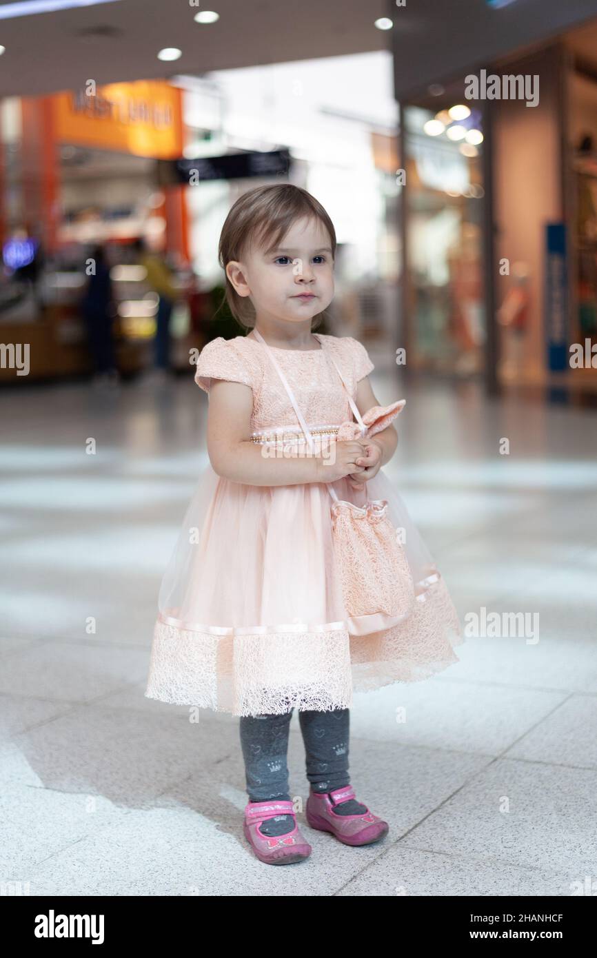 Surprised baby, Wow. in store, baby saw plush toy Stock Photo - Alamy