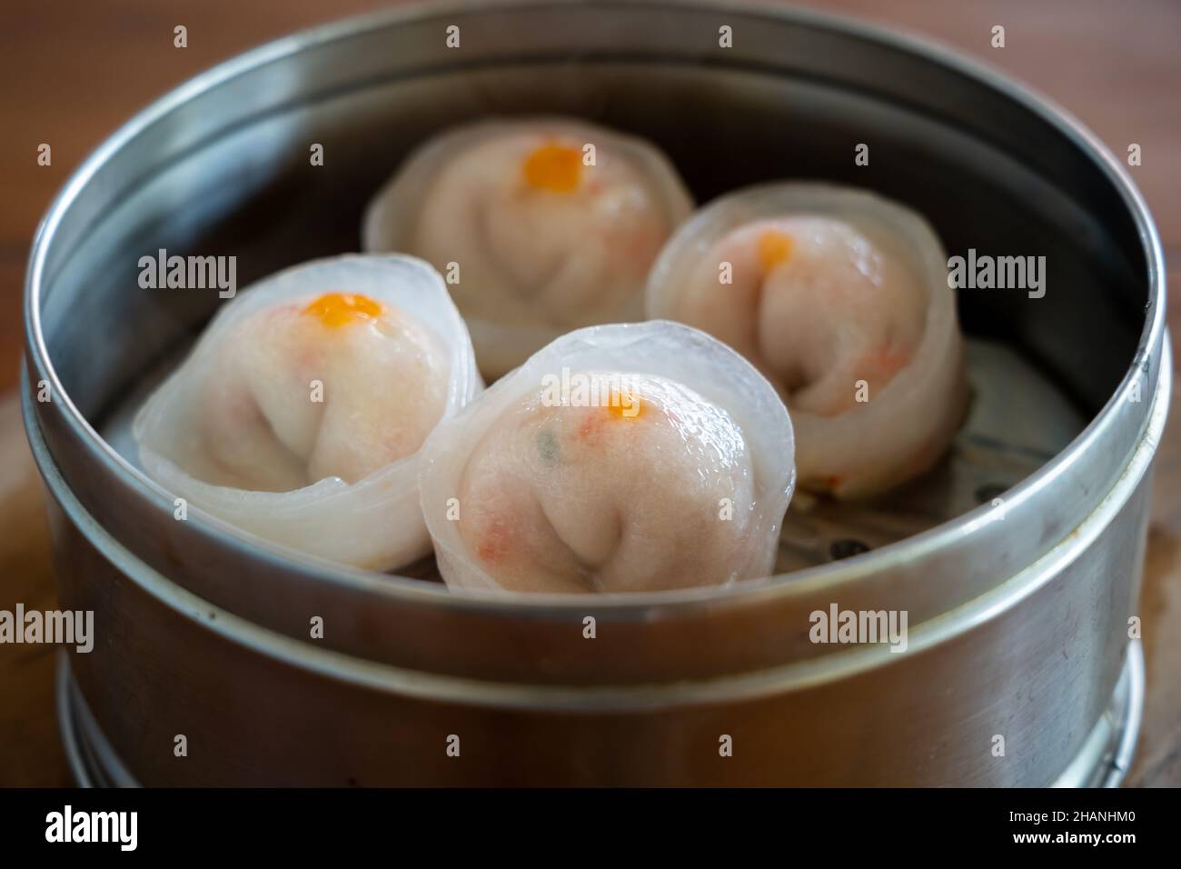 Four pieces of Dim Sum in a Metal pan Stock Photo - Alamy