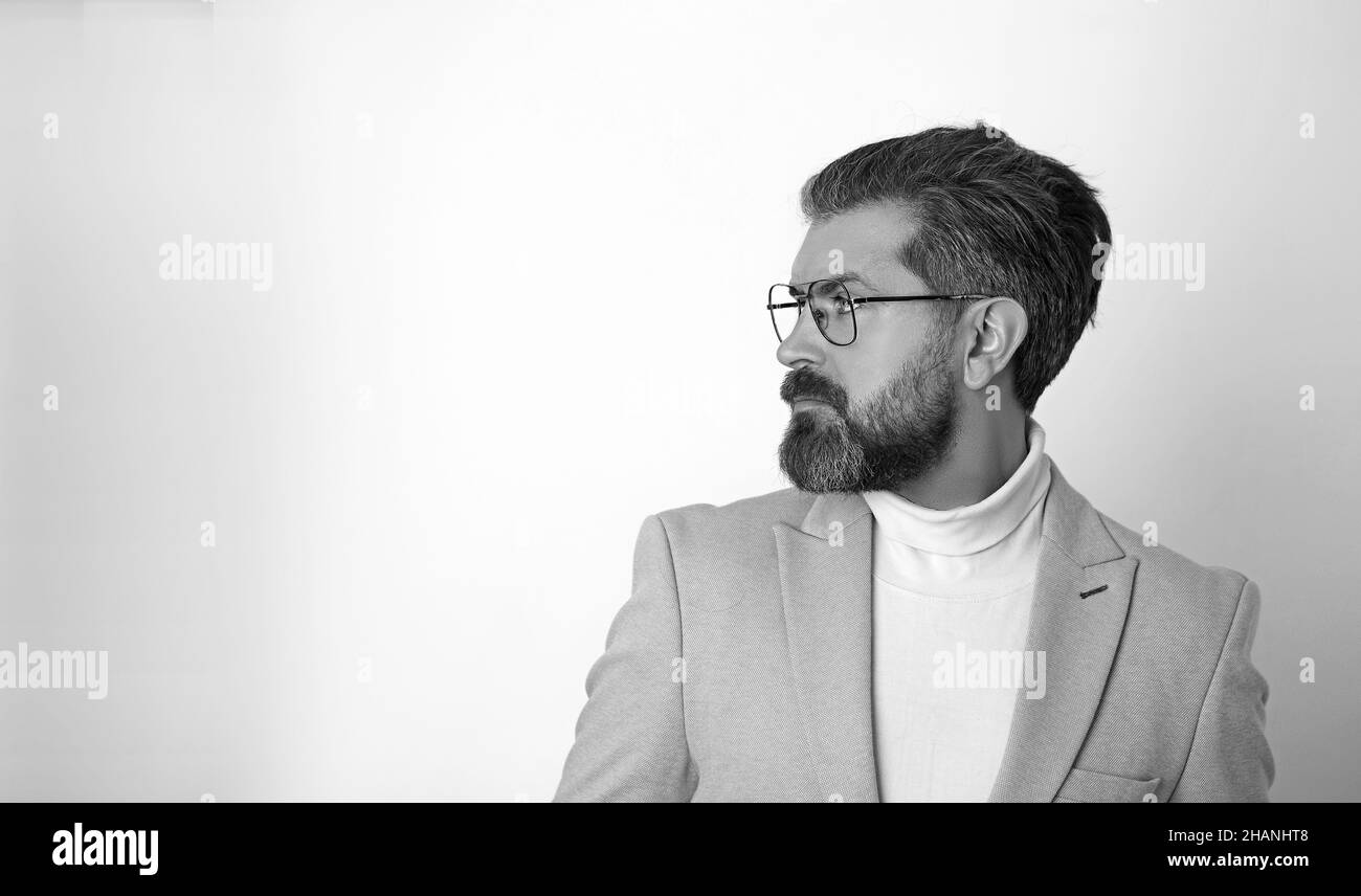 Side view portrait of serious fashionable handsome man in blue suit ...