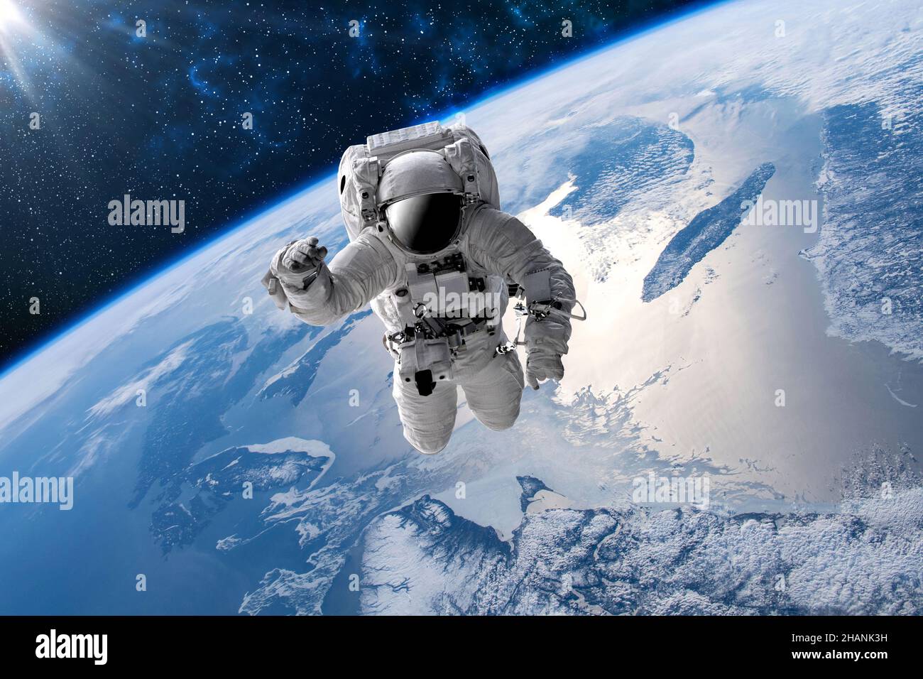 Astronaut in outer open space over the planet Earth.Stars provide the ...