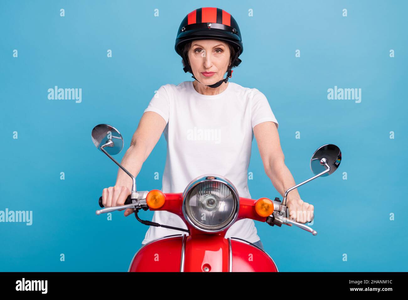 Old woman wearing helmet isolated hi-res stock photography and images ...