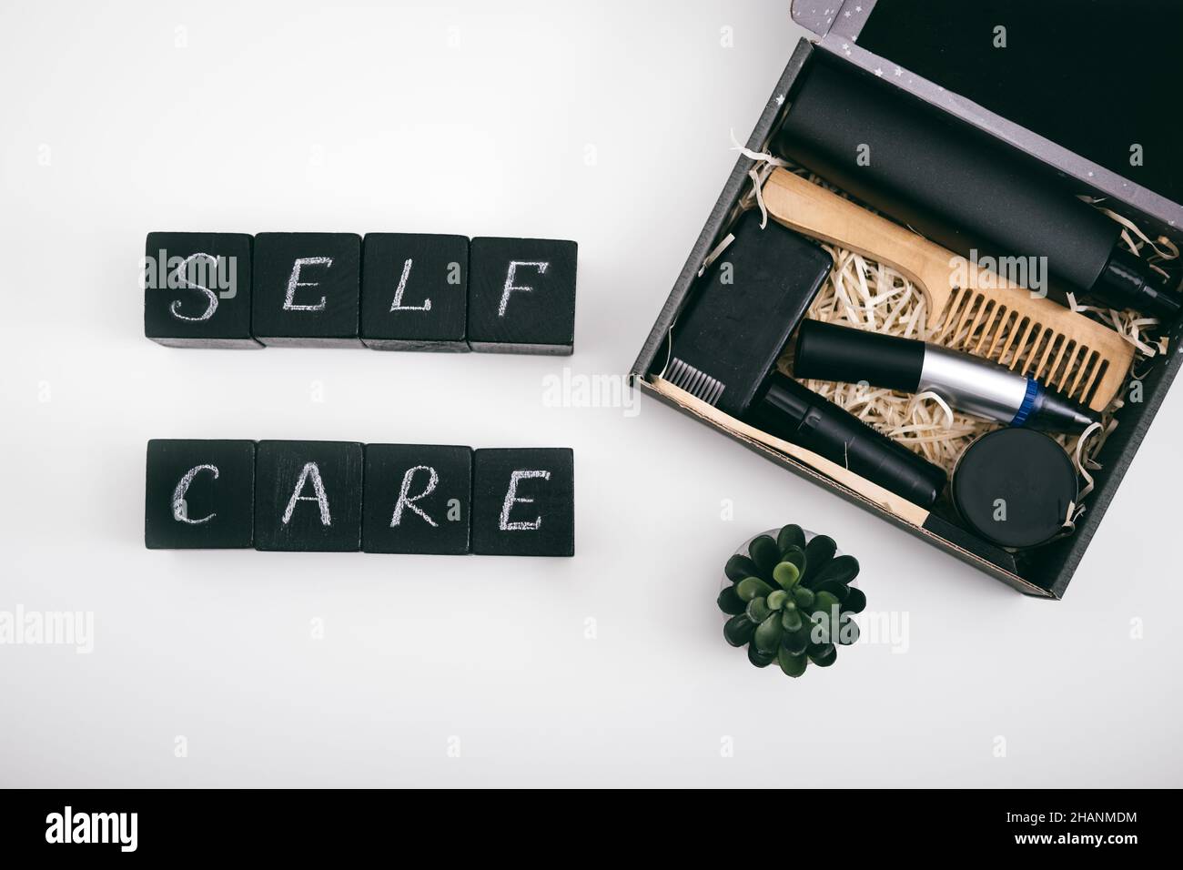 Men self care kit black box with male beauty care products and devices ...