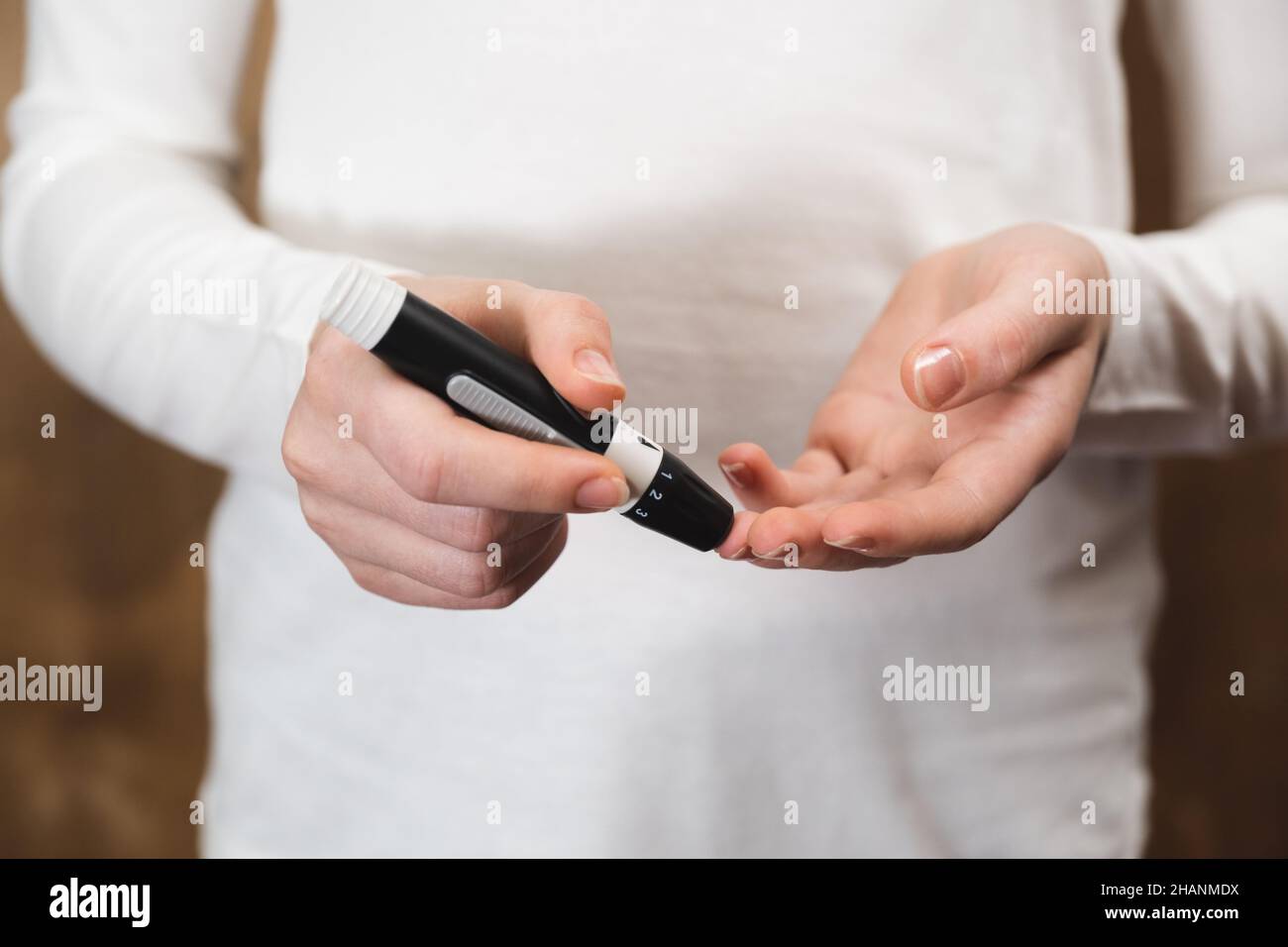 Diabetes checking blood sugar level. Child using lancelet and ...