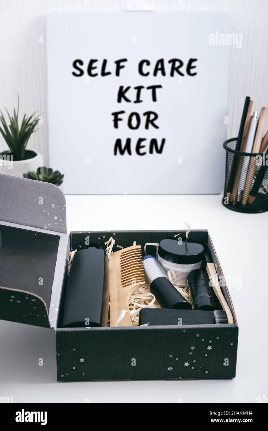 Men self care kit black box with male beauty care products and devices ...